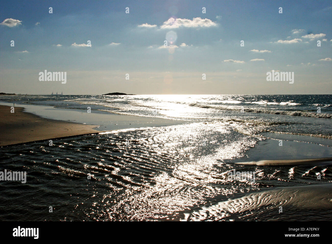 Lone beach at sunset Stock Photo - Alamy