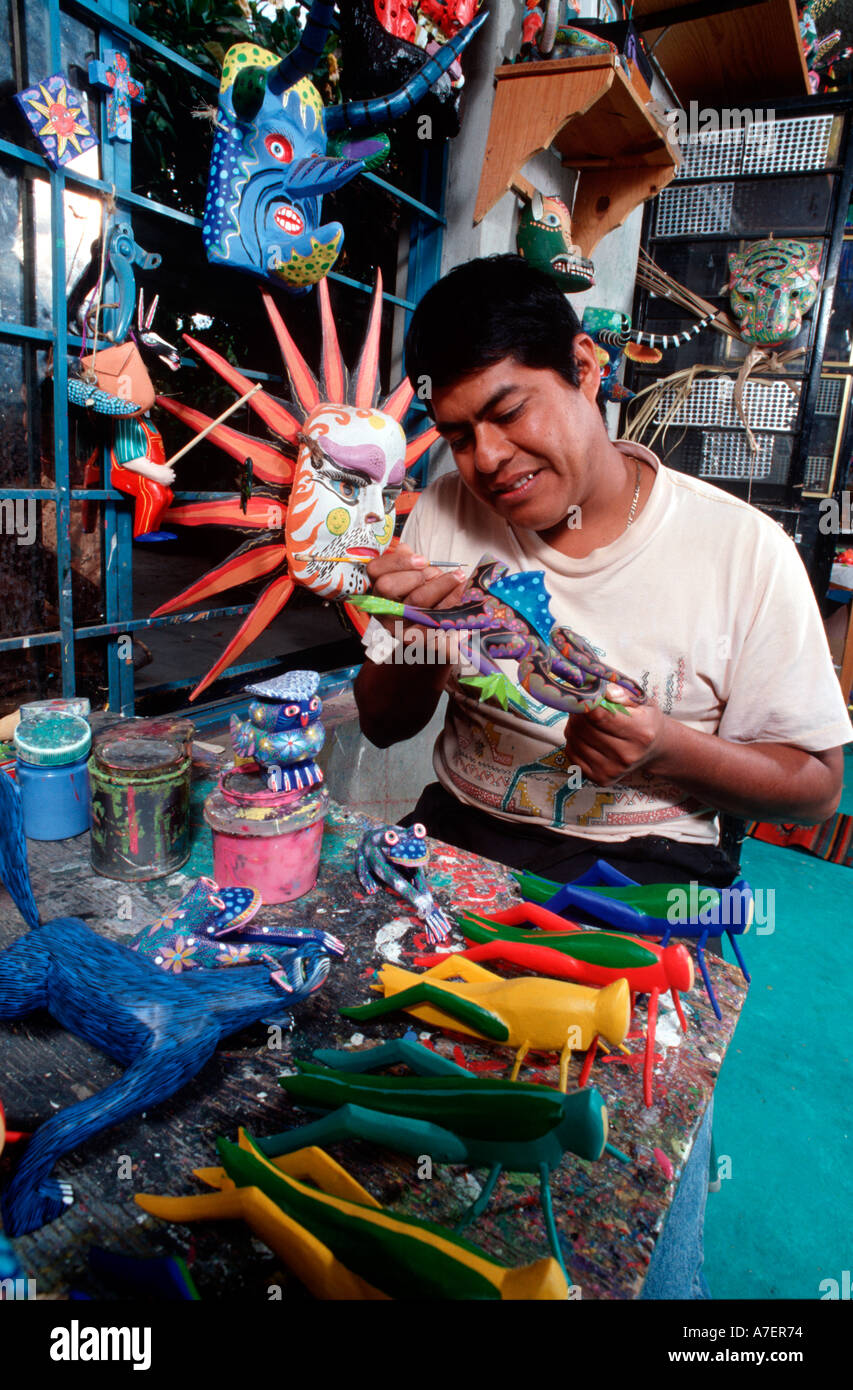 Mexico, Oaxaca, Tilcajete, Painting alibrijes (hand-painted wooden ...
