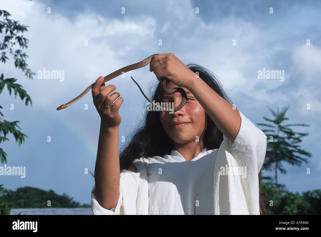 Mexico, Chiapas, Lacanja, Selva Lacandona. Lacandon Indian holding a ...