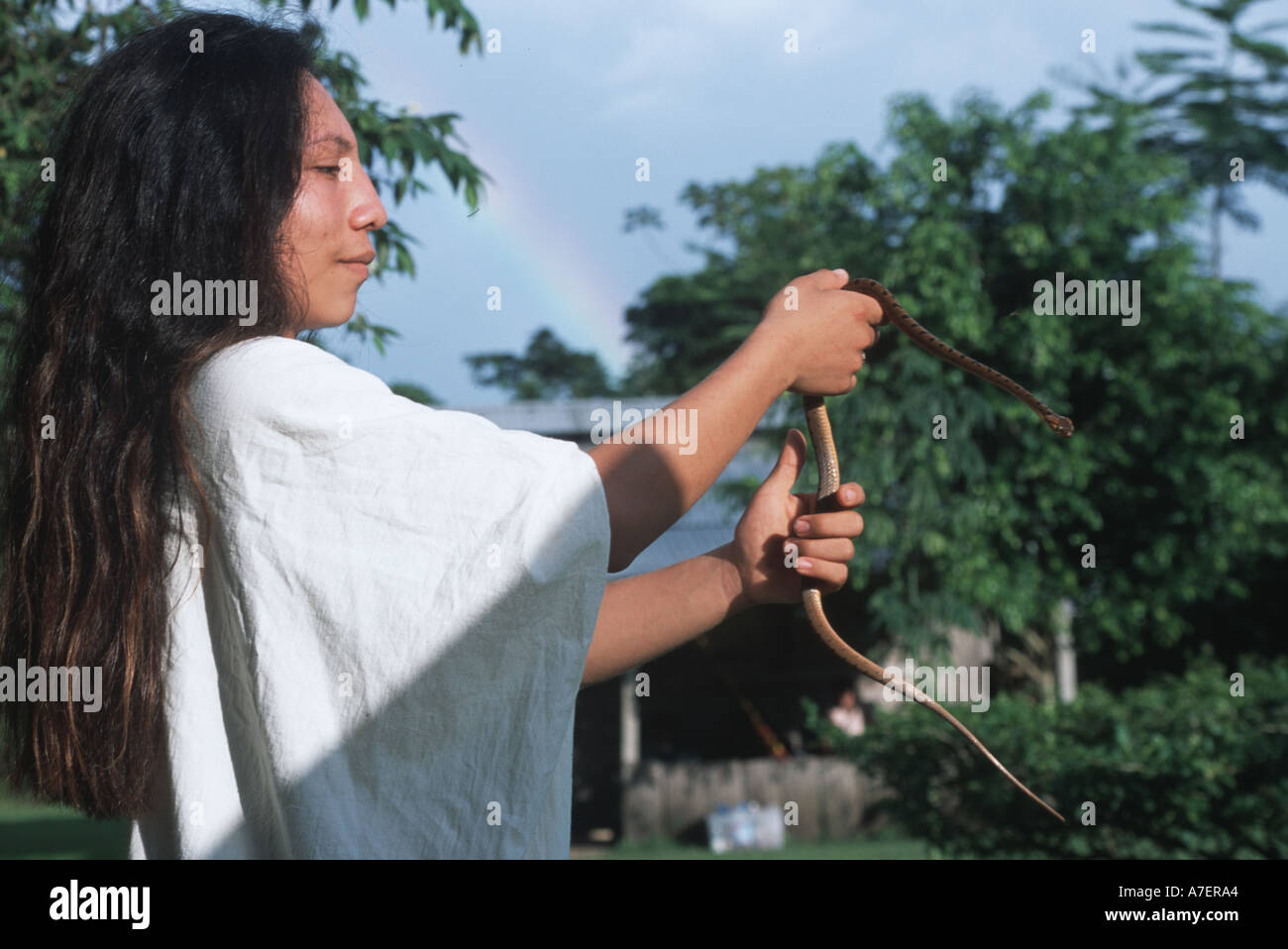 Mexico, Chiapas, Lacanja, Selva Lacandona. A Lacandon Indian holding ...