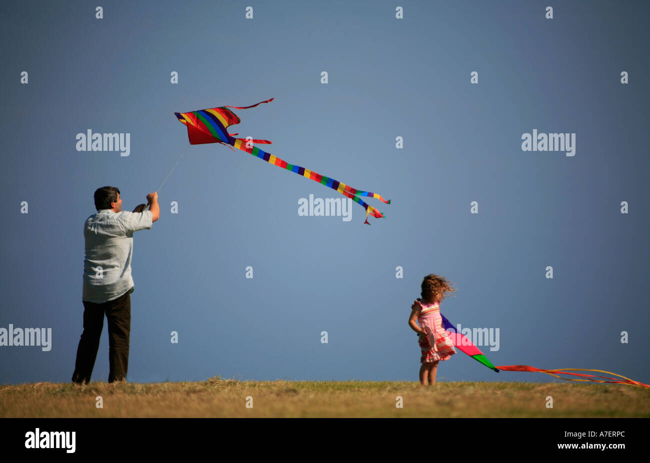 Flying a kite Stock Photo - Alamy