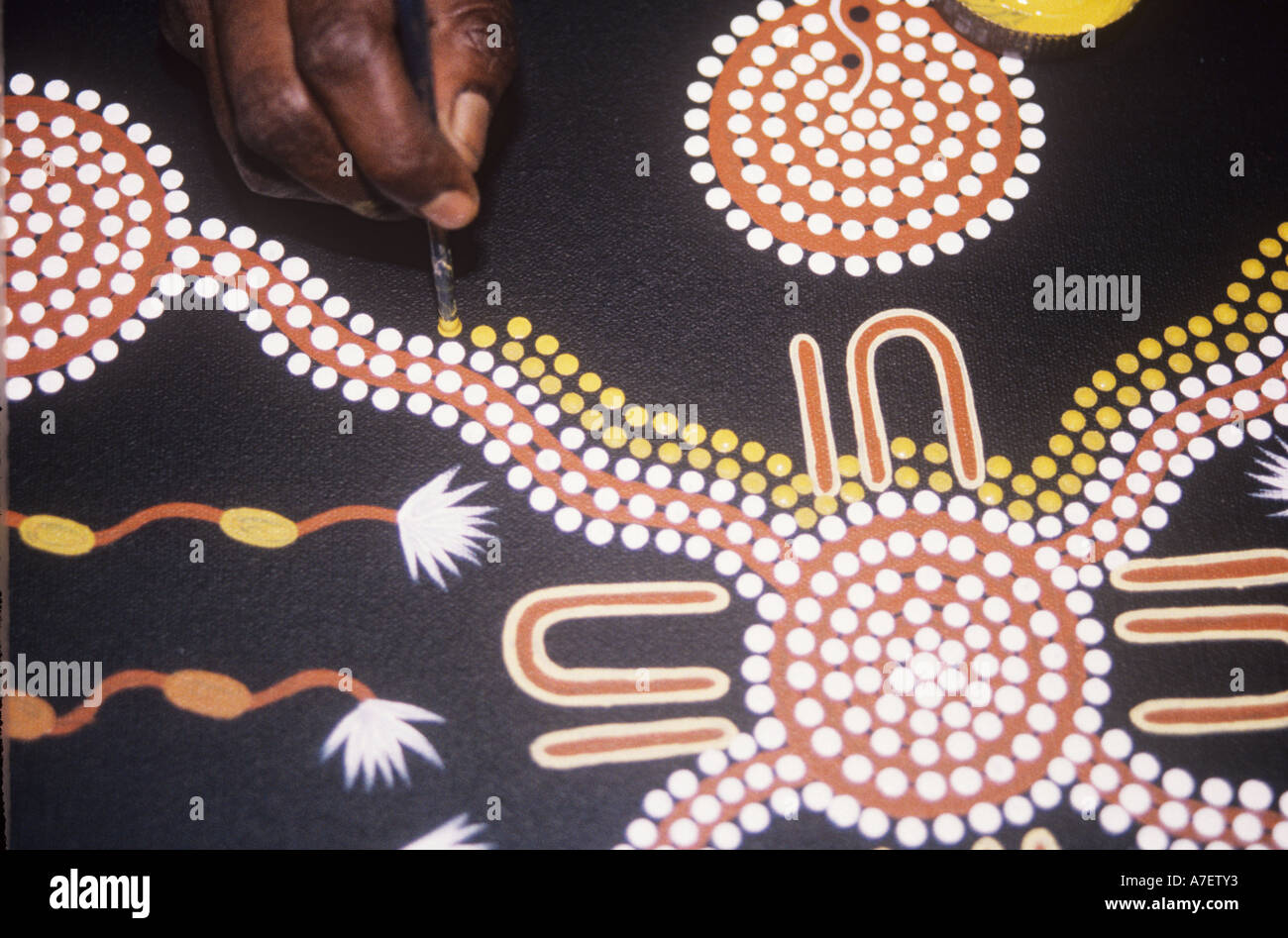 Aboriginal artist painting images from the dreamtime Central Australia ...