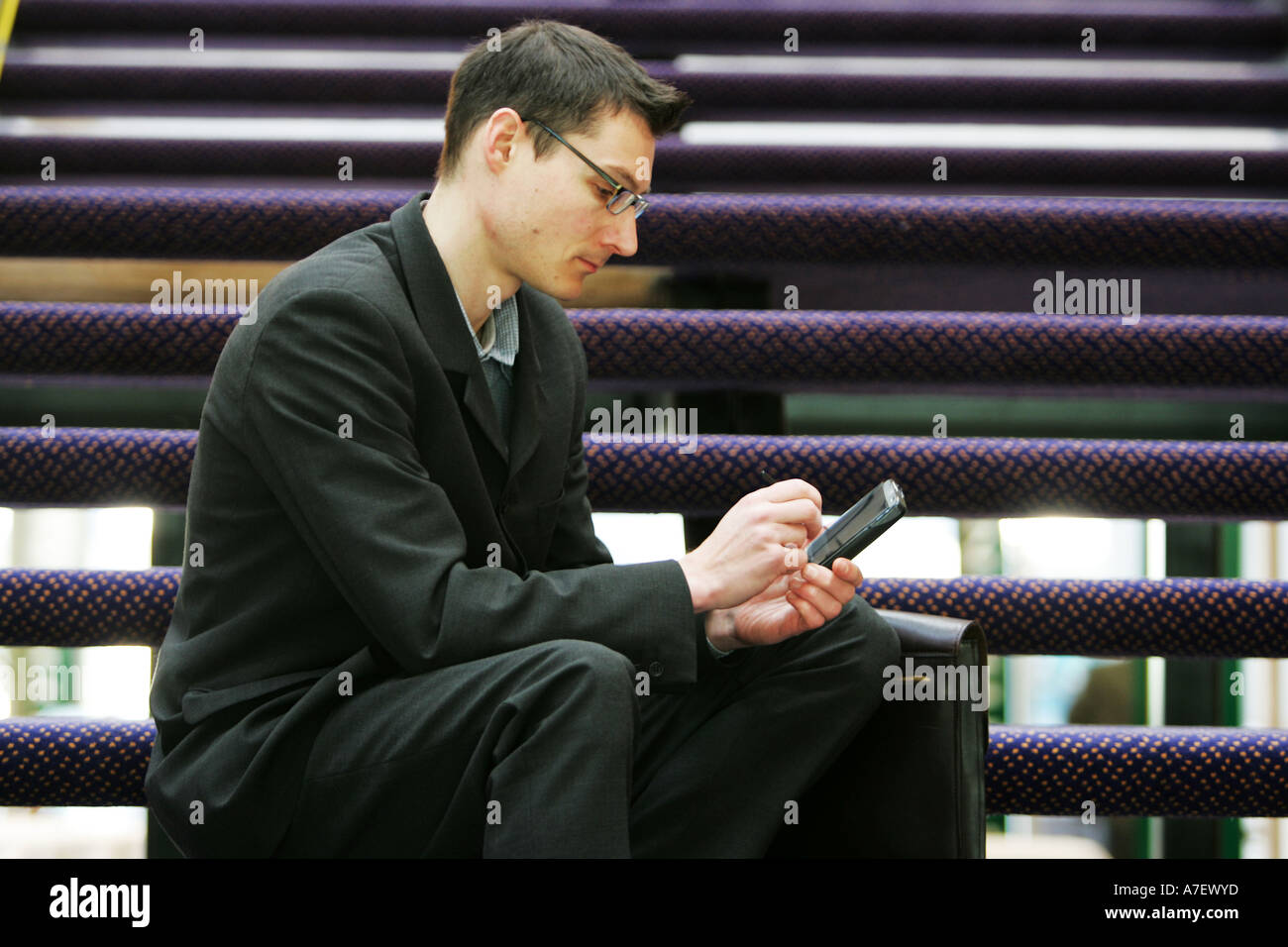 DEU, Germany : Man is working with a PDA pocket-computer Stock Photo ...