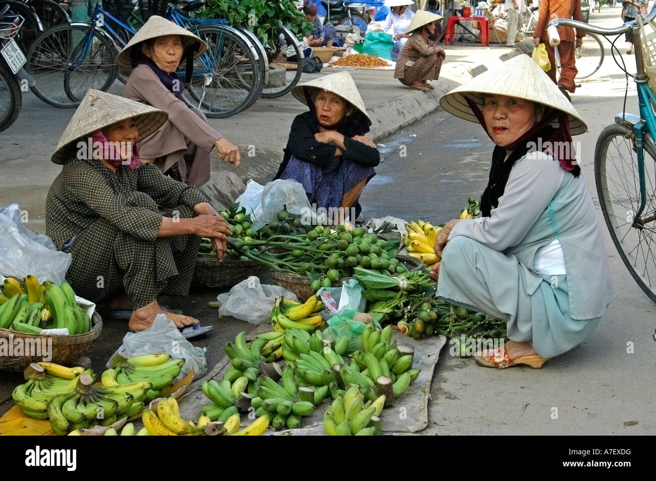 Female fruit traders by the roadside, Vietnam Stock Photo - Alamy