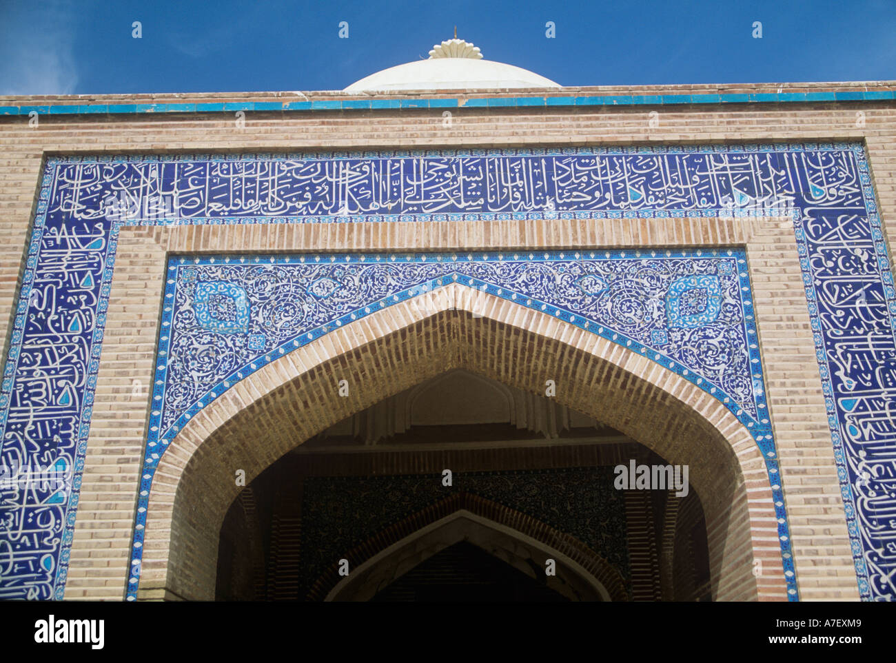 Quranic verses decorate tiles covering an iwan of the Shah Jehan Mosque ...