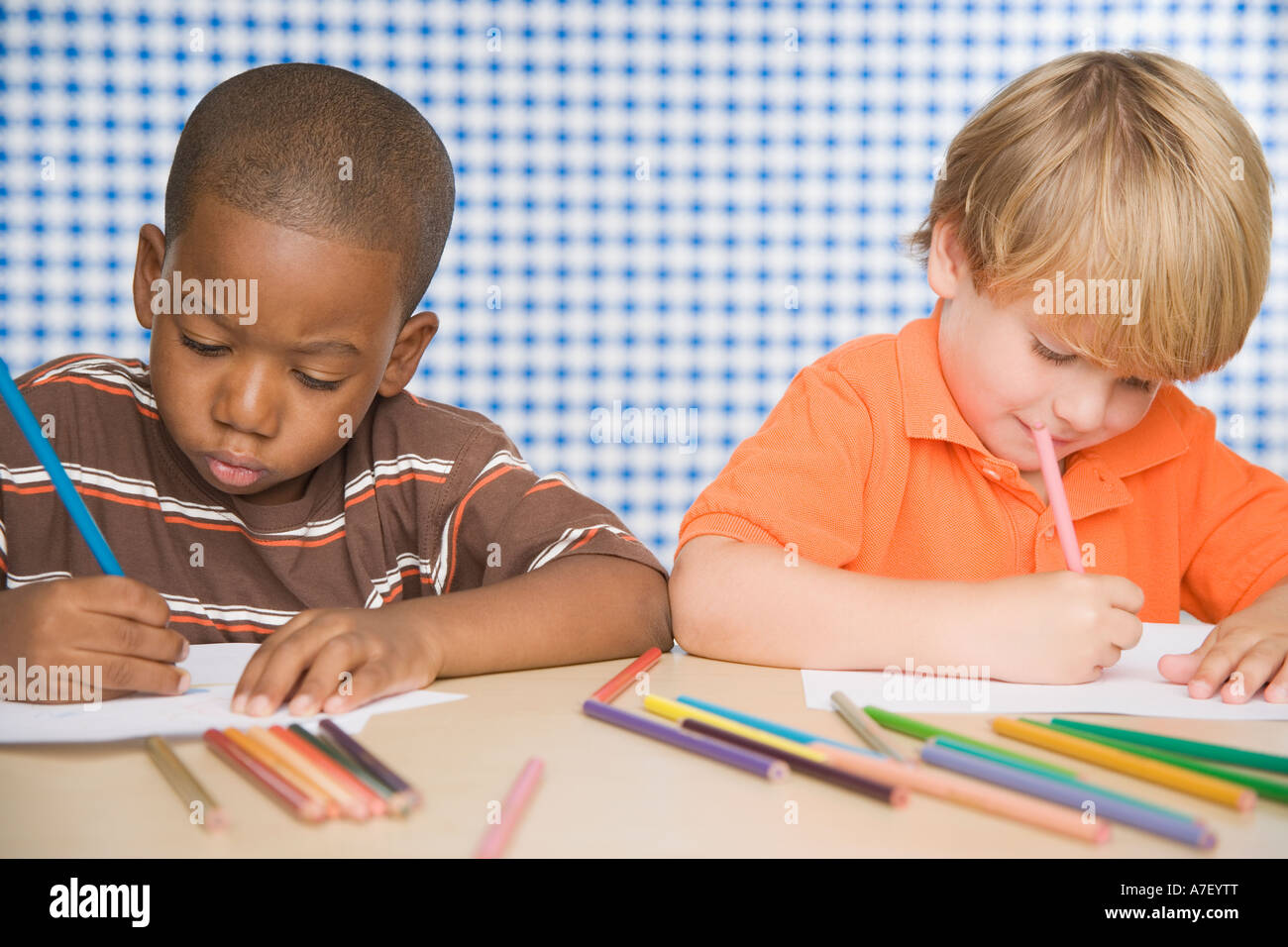 Two young boys coloring Stock Photo - Alamy