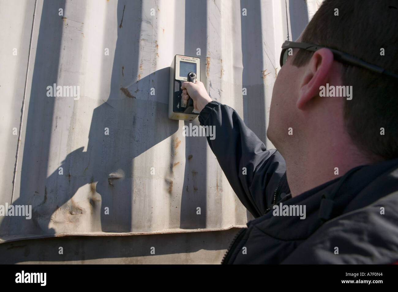 A CBP officer scans container with radiation isotop identifier at Port ...