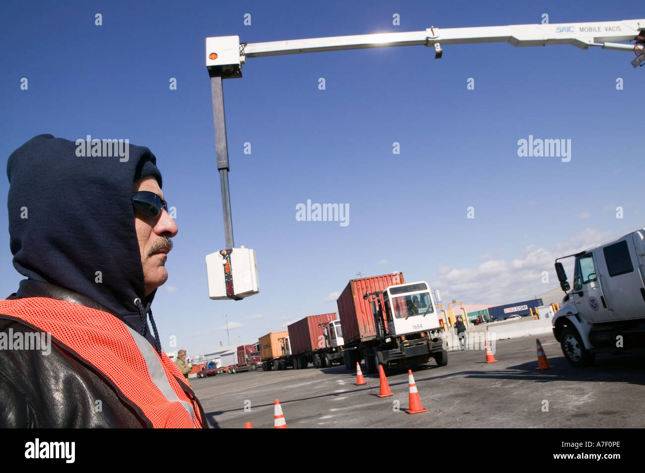 A Customs and Border Protection officer watches operations of a VACIS ...