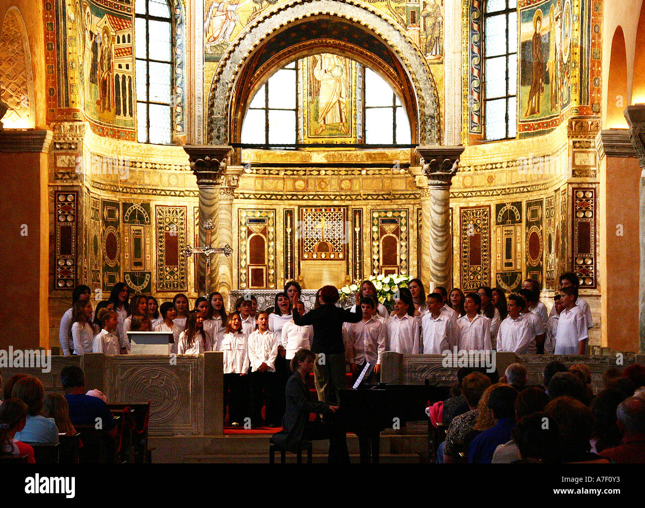 Children's choir performing in the Byzantine Basilica of Euphrasius in ...