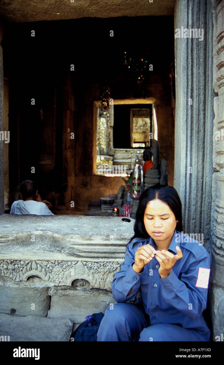 Female Temple Guard filing nails, The Bayon, Angkor Thom, Cambodia ...