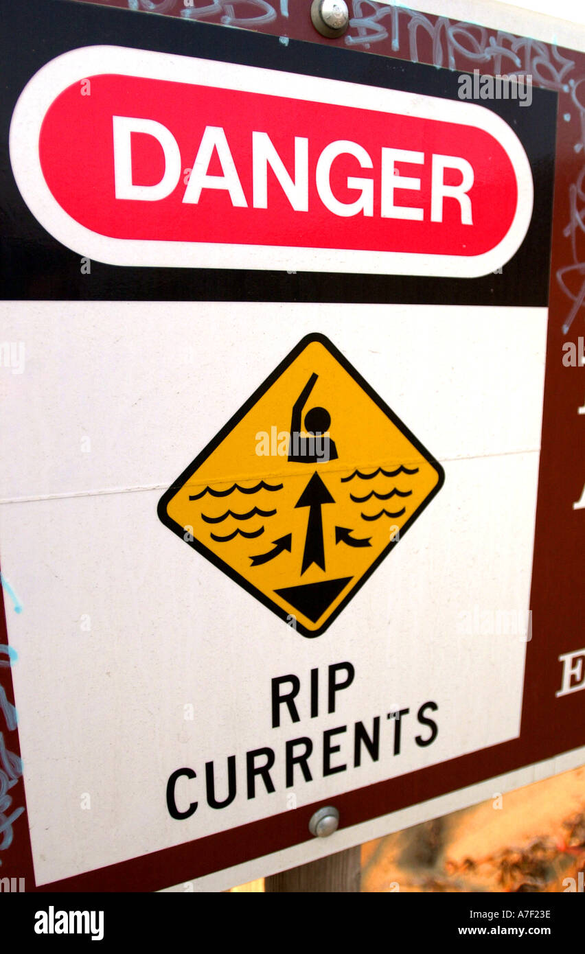 Ripe tide warning sign at public beach Stock Photo - Alamy