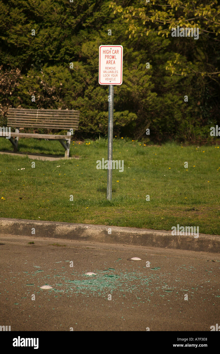 Broken glass from car window in parking area known for car prowling and ...
