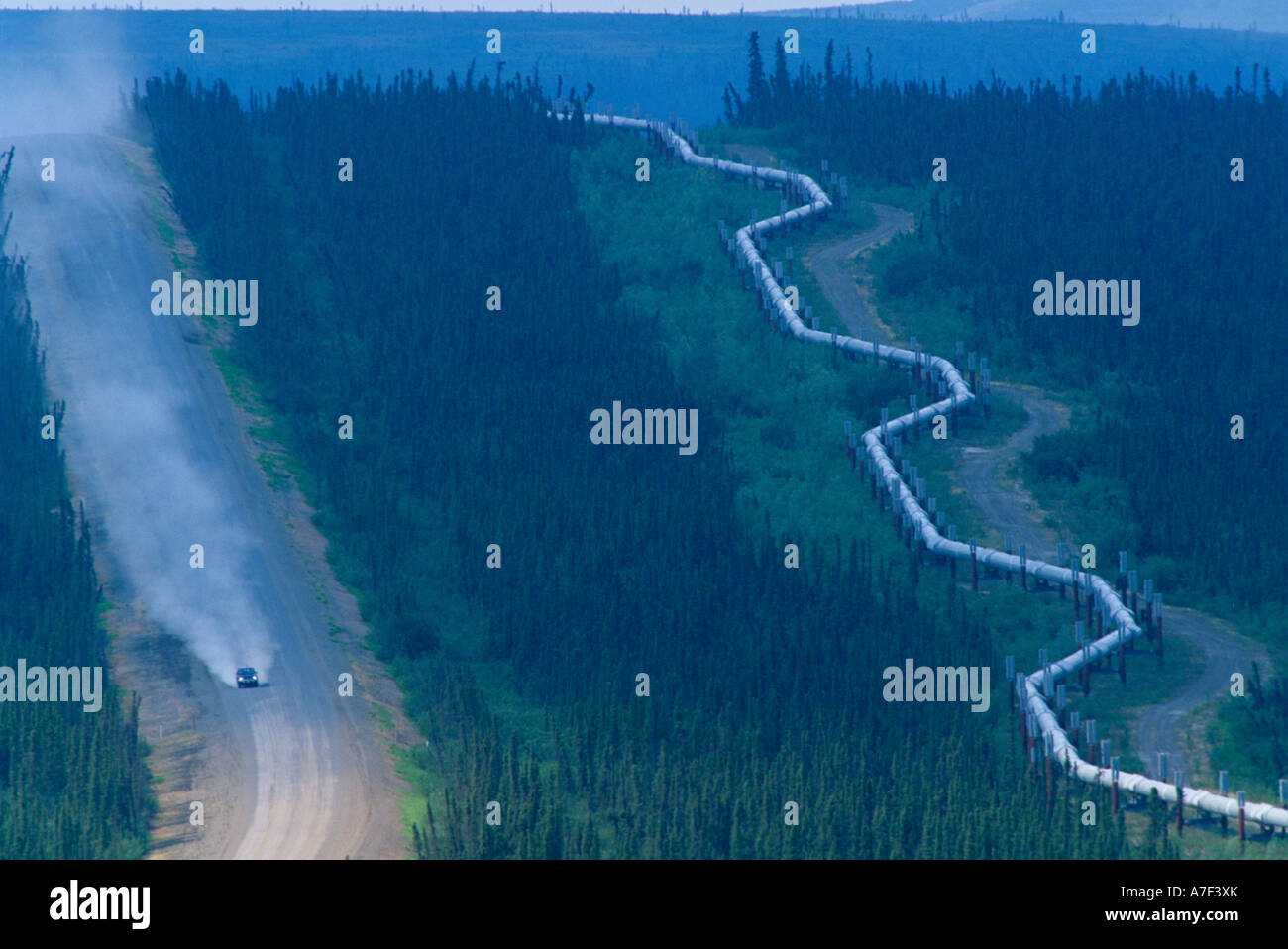 USA Alaska Truck drives past weaving Trans Alaska Oil Pipeline along ...