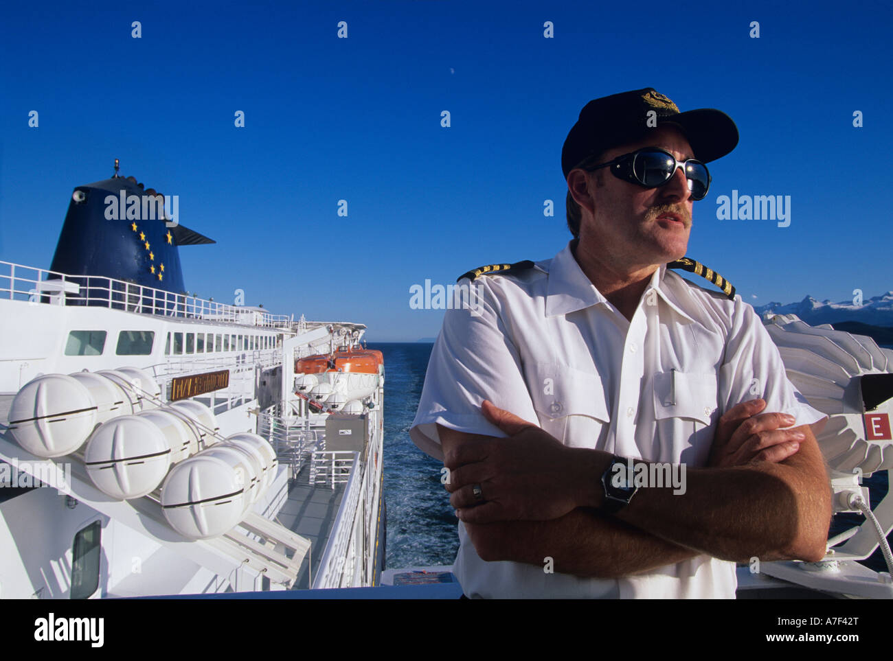USA Alaska Capt Jonathan Ward stands on bridge of Alaska Ferry MV ...