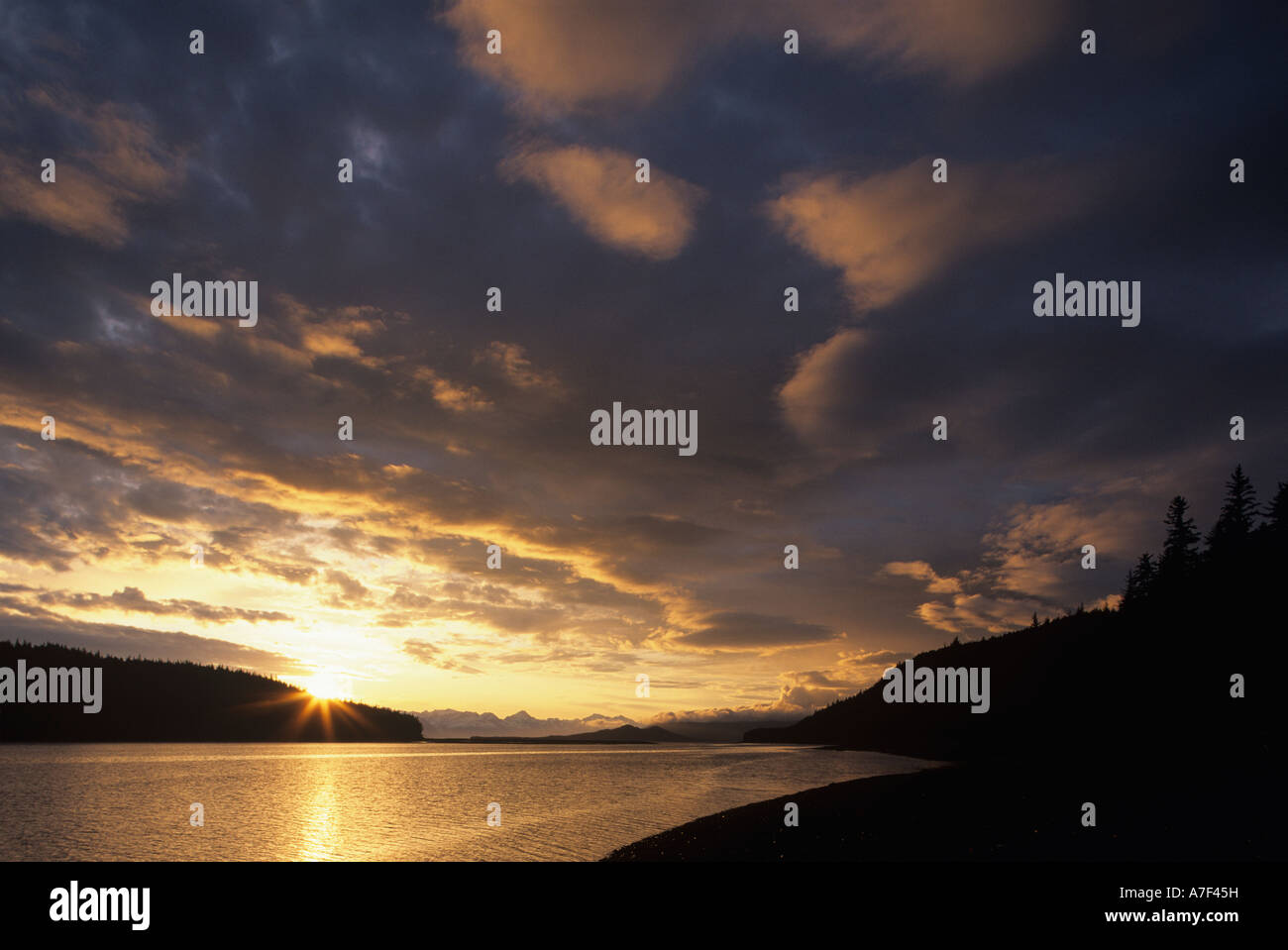 USA Alaska Midnight sunset behind Chilkat Range peaks along Lynn Canal ...