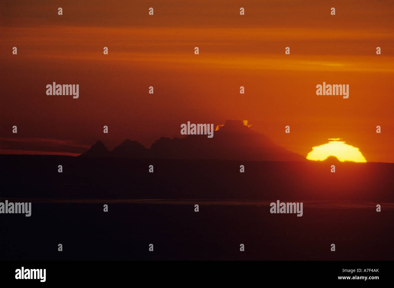 USA Alaska Winter sun sets behind Mount Iliamna volcano in Alaska Range ...