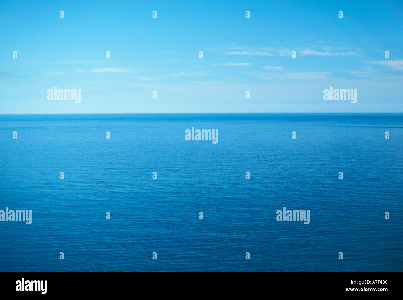 Wide expanse of deep blue calm open water stretching out into the ...