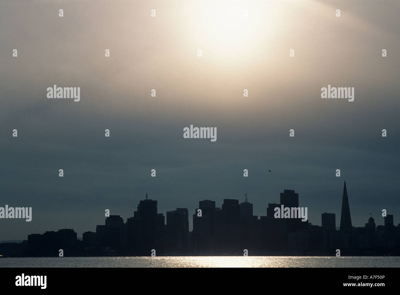 Sun setting behind island silhouette hi-res stock photography and ...