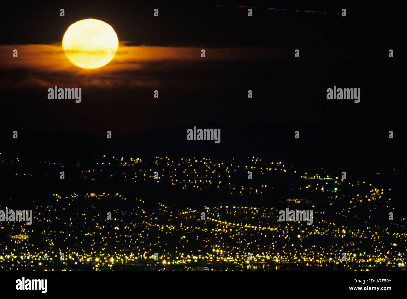 USA California San Francisco Full moon rises over Berkeley Hills and ...