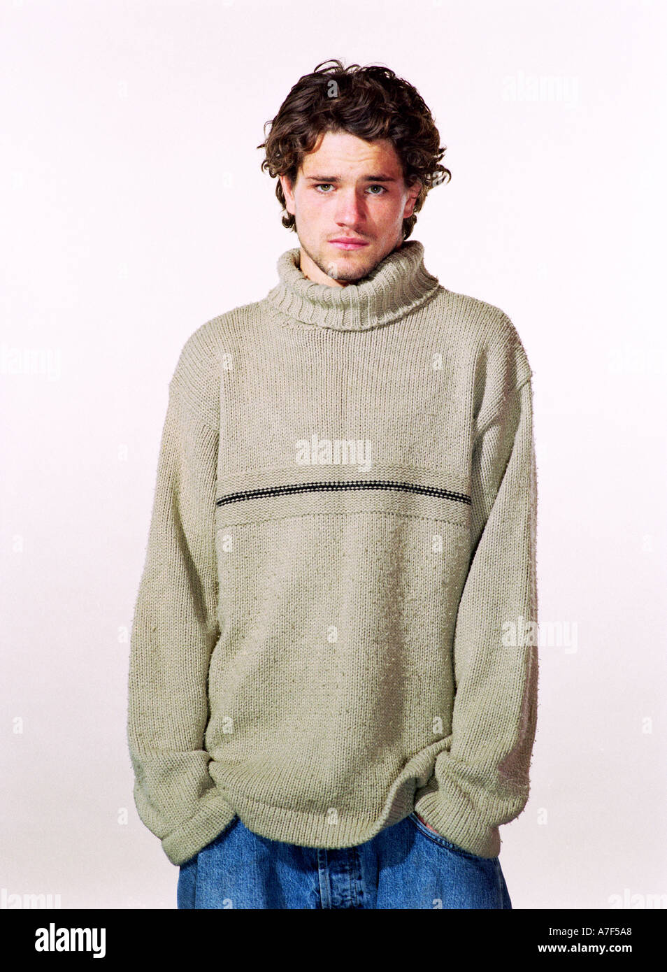 Single teenage boy looking at the camera in the studio Stock Photo - Alamy