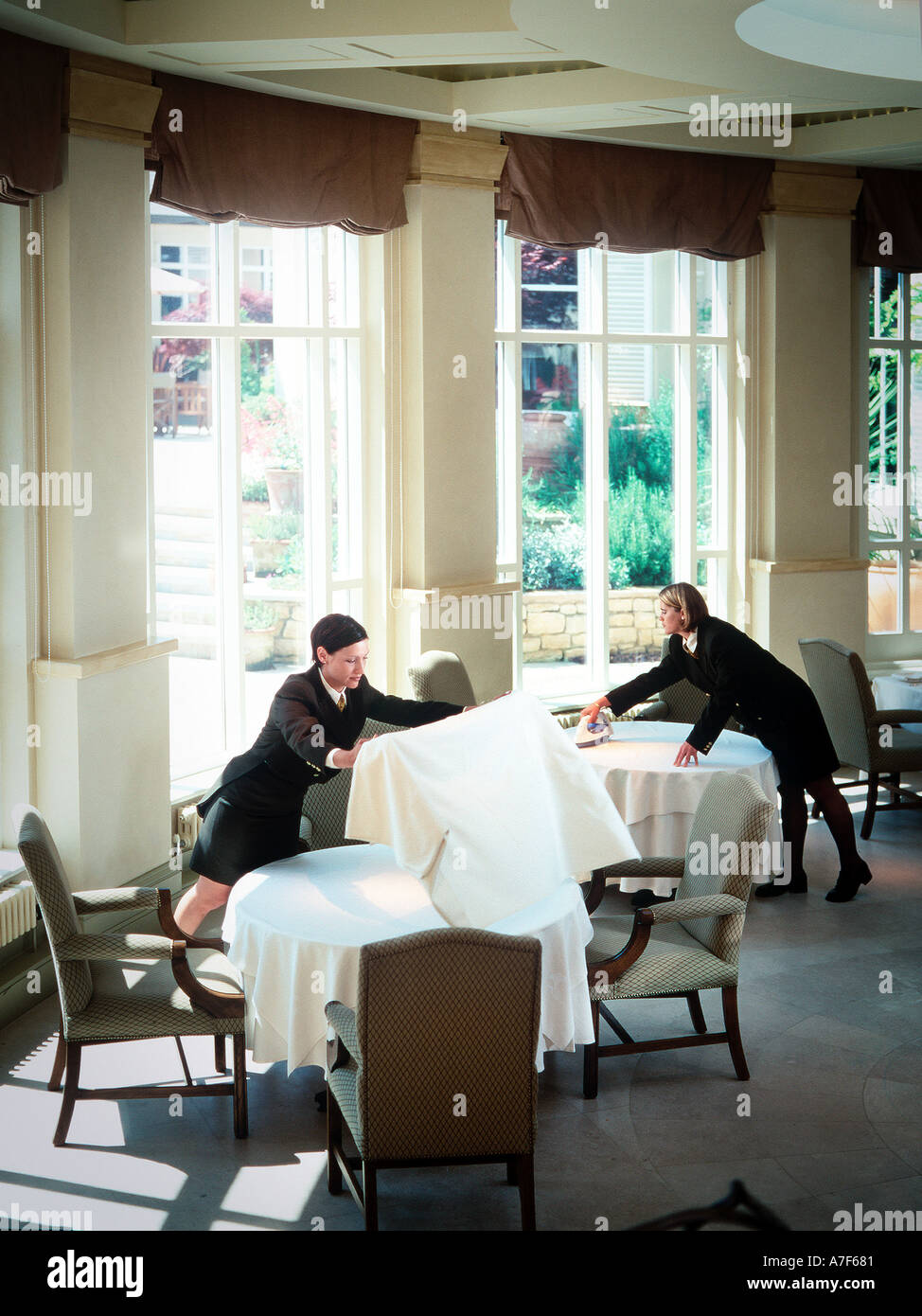 Waitress laying tables hi-res stock photography and images - Alamy