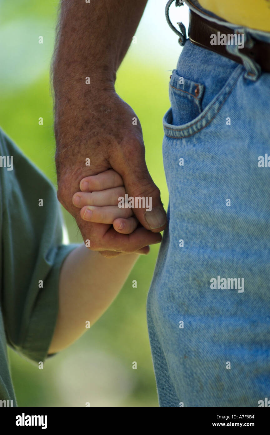 Father child walking hand in hand Stock Photo - Alamy