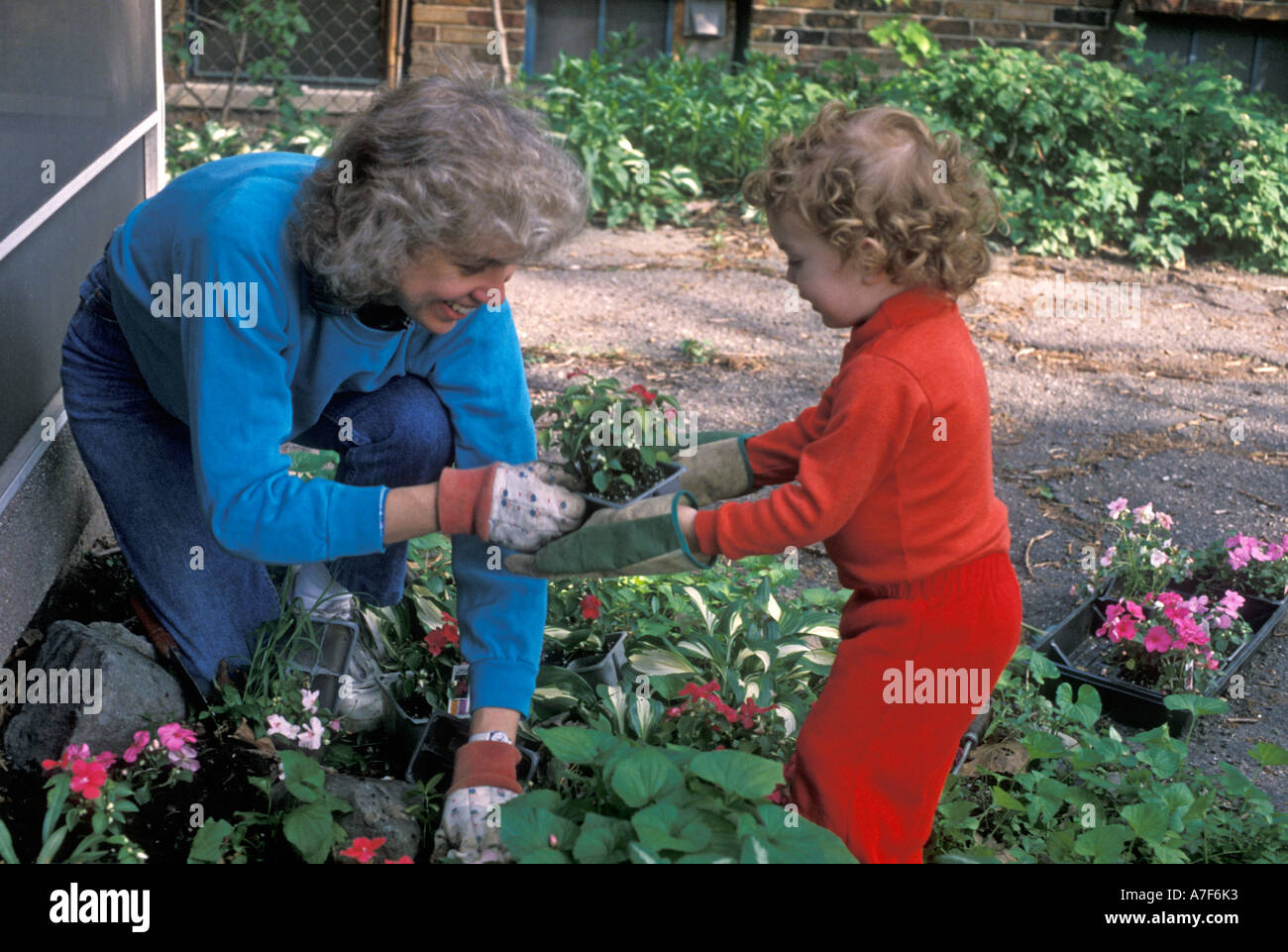 Detroit Michigan Two year old Mariel West helps her mother Susan Newell ...