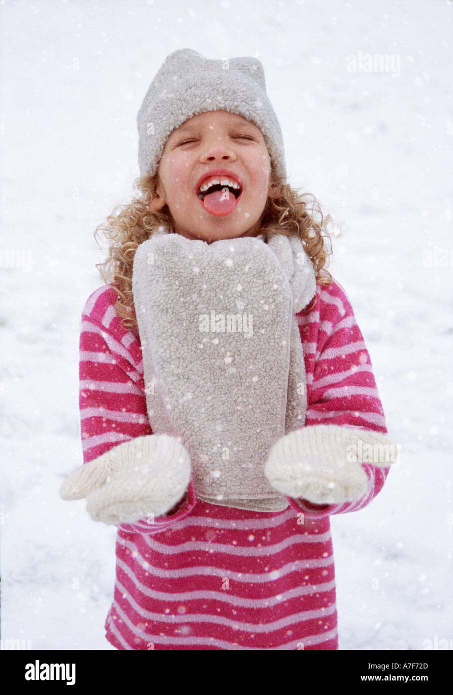 Girl catching snowflakes tongue hi-res stock photography and images - Alamy
