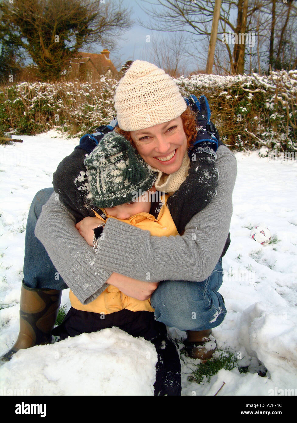 Mother son child snow hug hi-res stock photography and images - Alamy