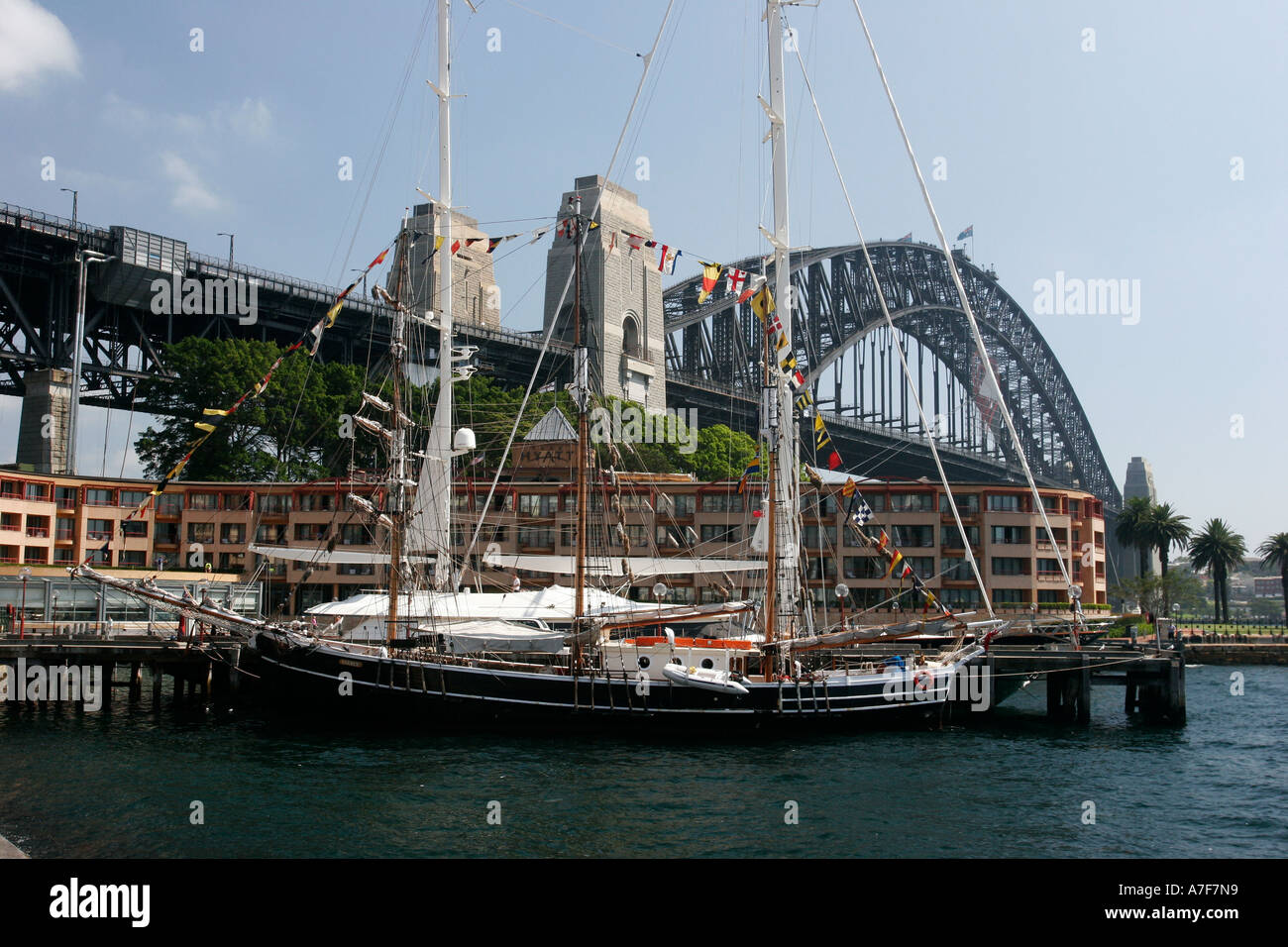The Rocks area of Sydney harbour with the harbour bridge in the ...