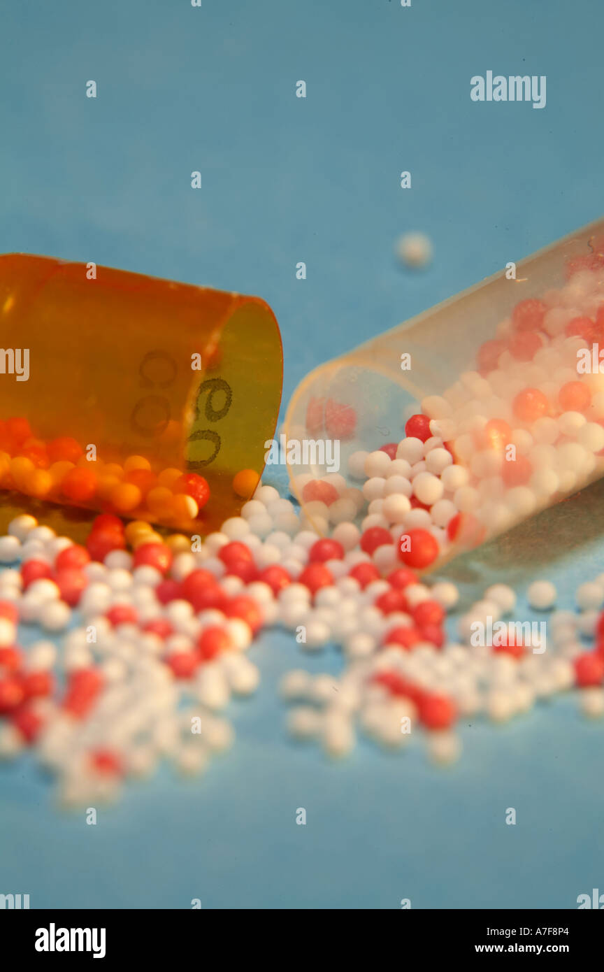 a broken-open medicine capsule Stock Photo - Alamy