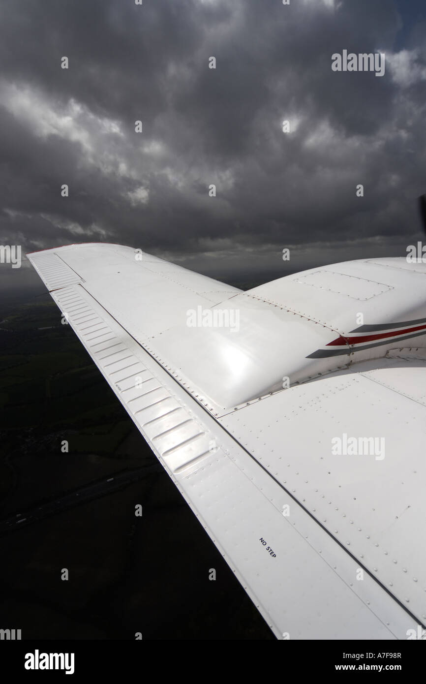 Wiew from left window of Piper Seneca Aeroplane of wing with dramatic ...