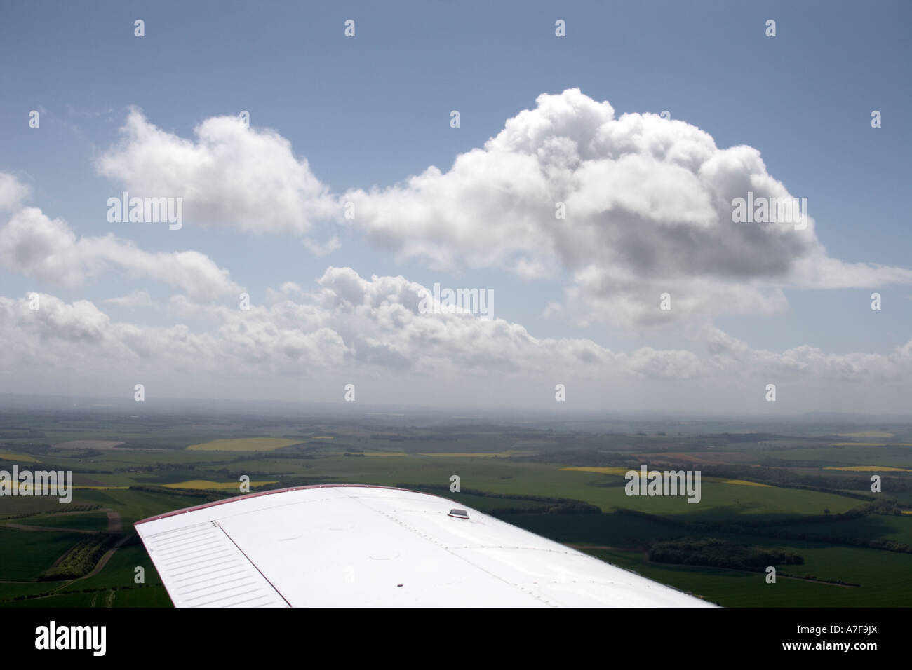 High level oblique aerial view south from left window of Piper Seneca ...