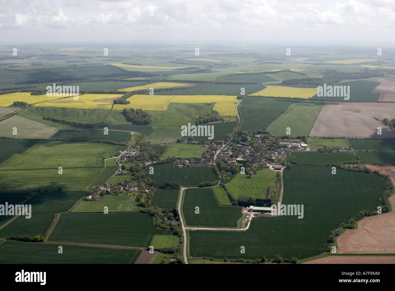 High level oblique aerial view south east of rape fields residential ...
