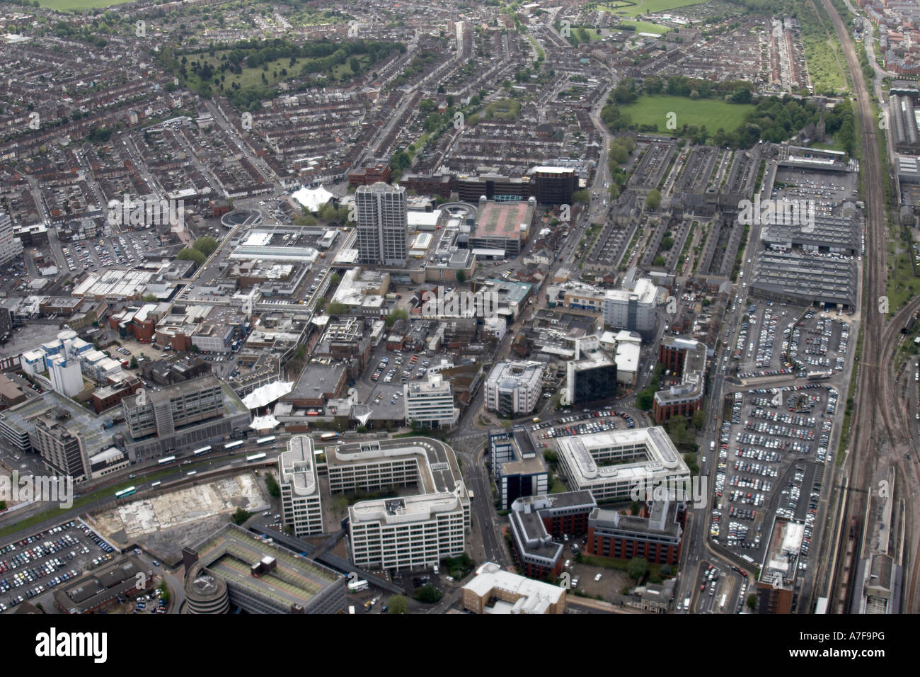 High level oblique aerial view of city centre buildings and residential ...