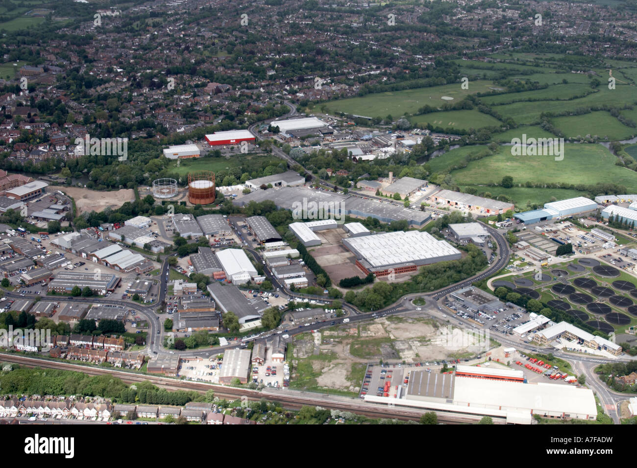 High level oblique aerial view north east of water works and railway ...