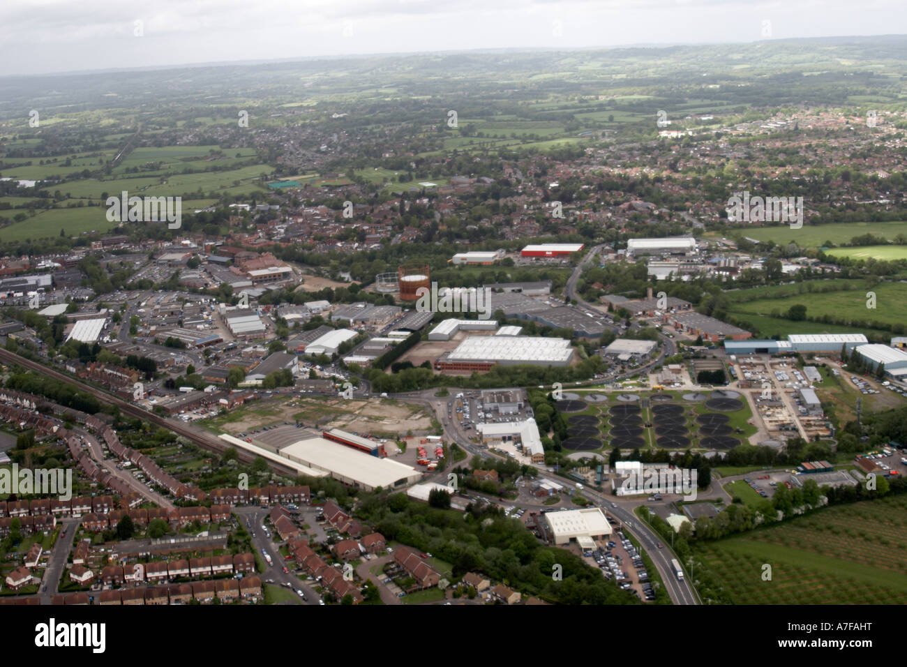 High level oblique aerial view north east of water works and railway ...