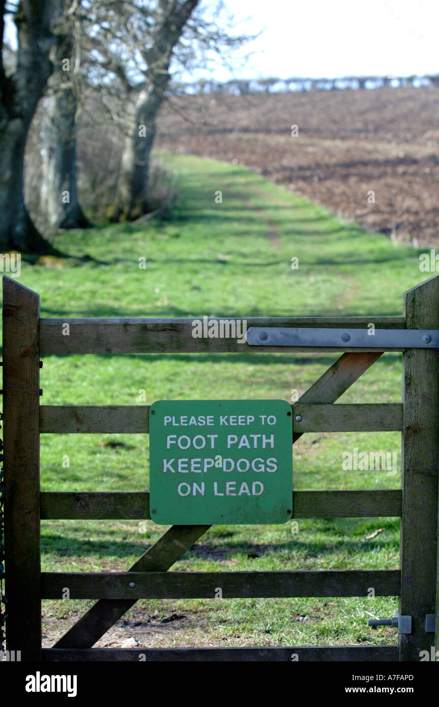 Country gate with warning sign for dogs to be kept on a lead Stock ...