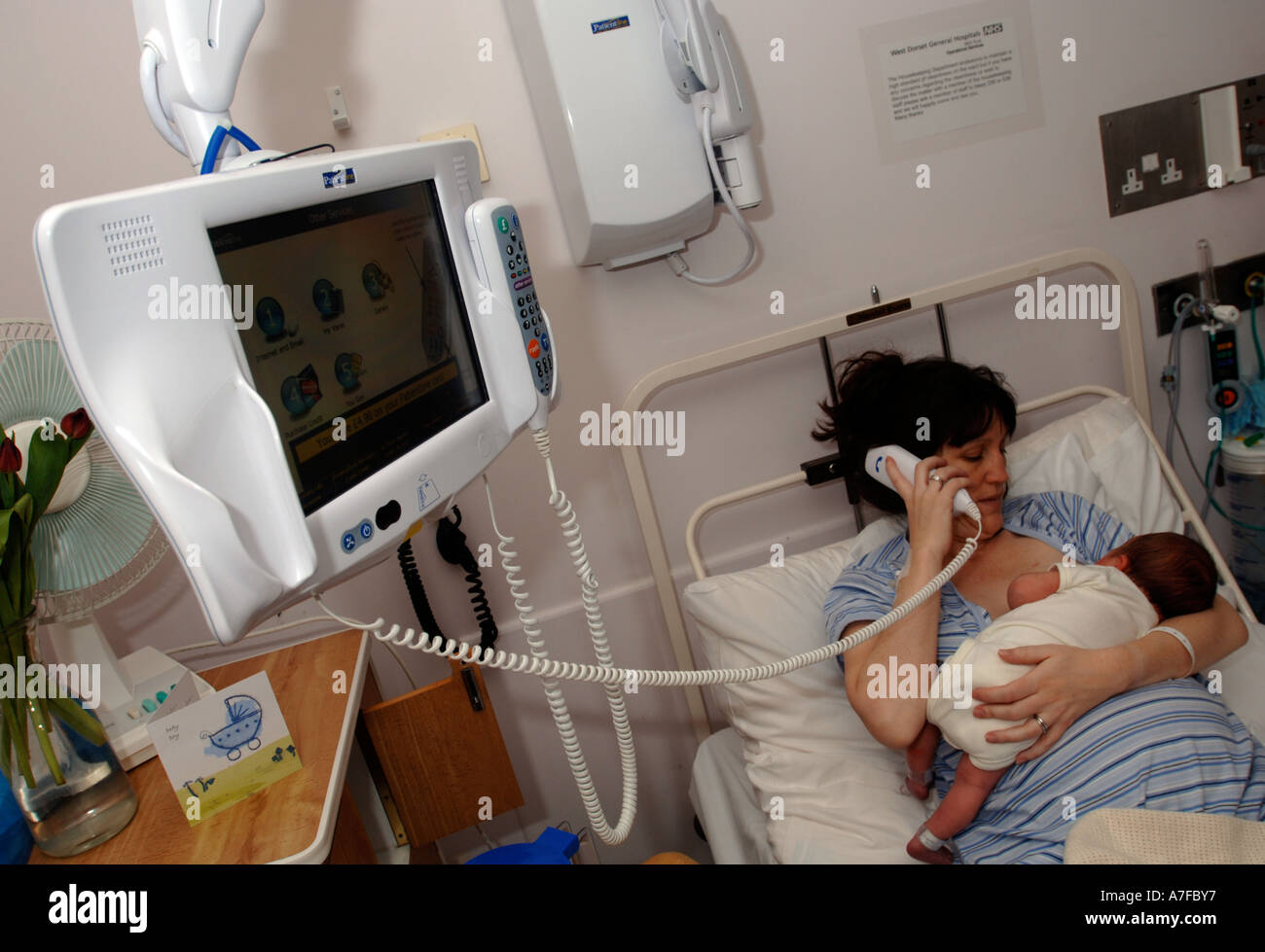Hospital patient on the telephone using the Patientline system ...
