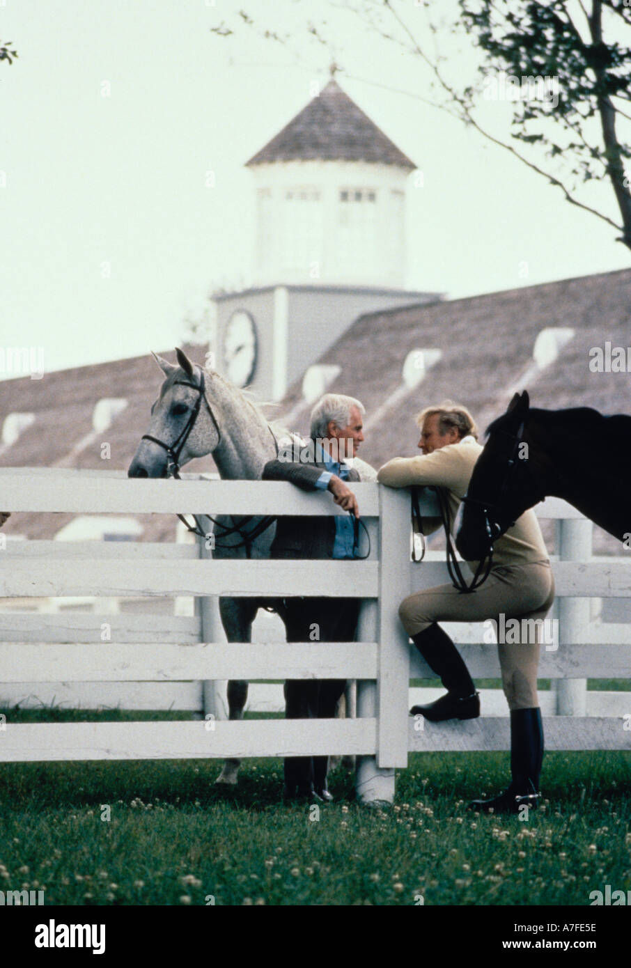 Two men talking over fence hi-res stock photography and images - Alamy