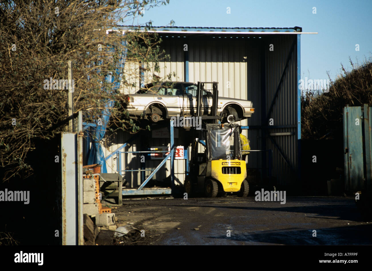 GWYNEDD NORTH WALES UK January An obsolete car on a ramp in a scrap ...