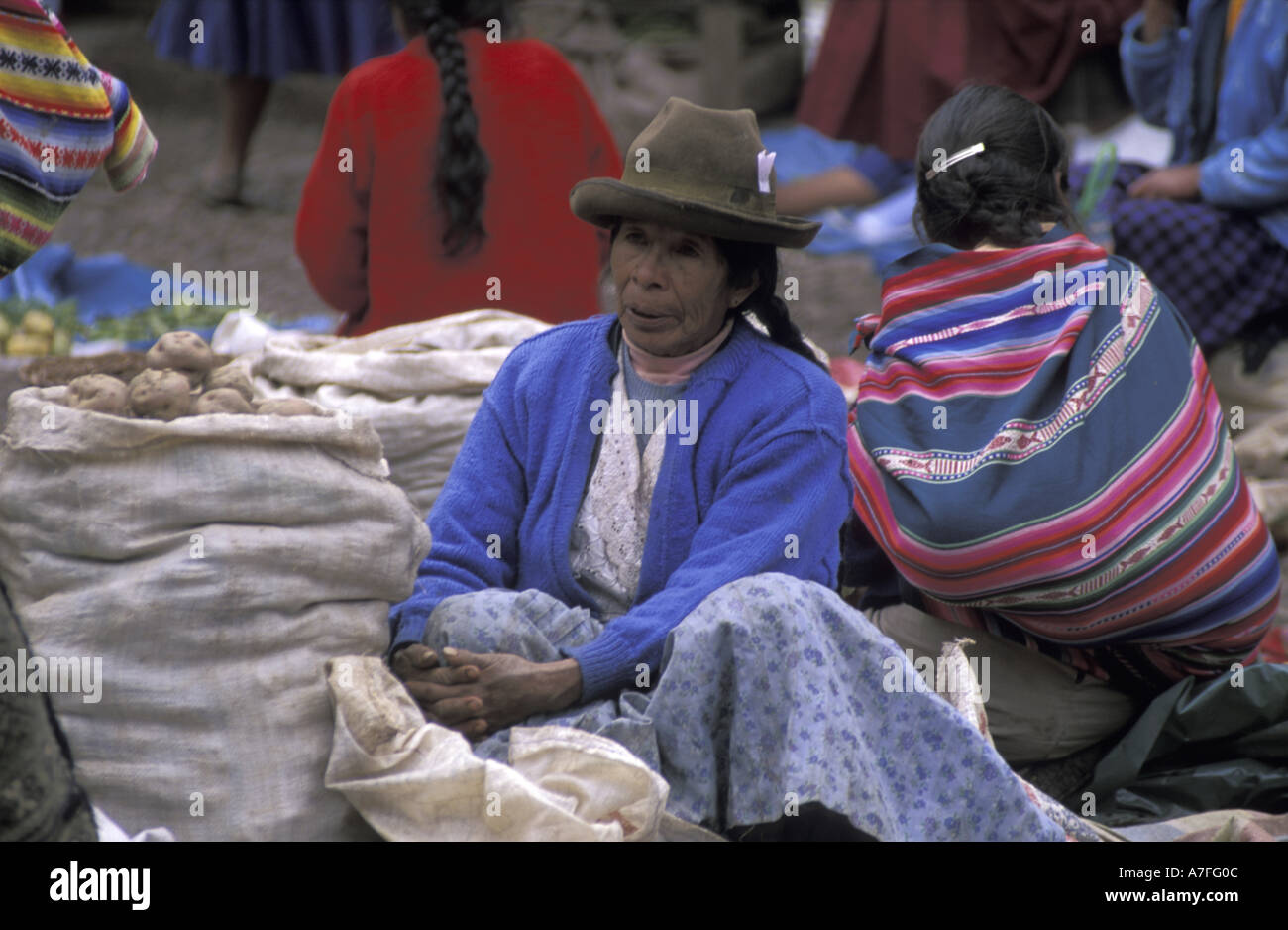 South America, Peru Old Peruvian Woman sitting in market Stock Photo ...