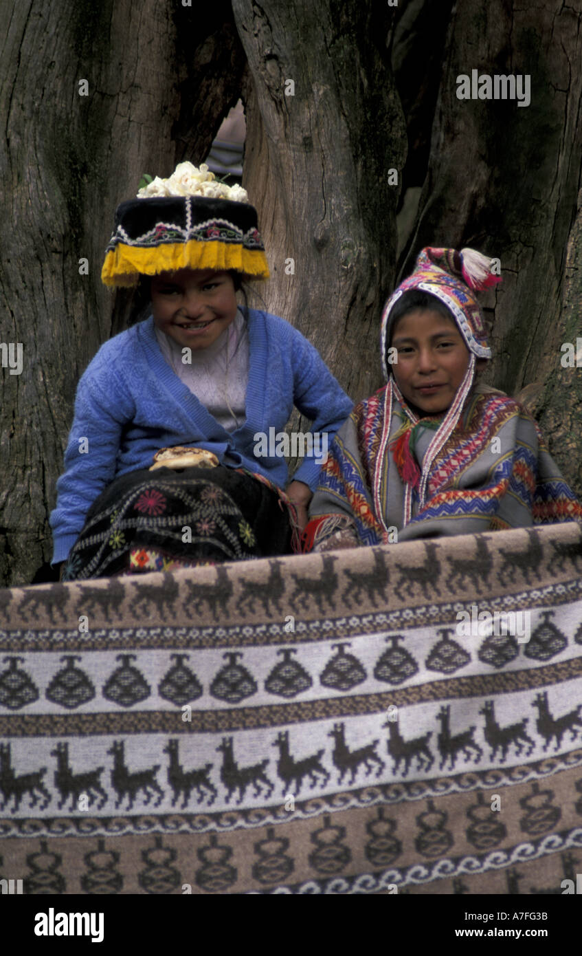 SA, Peru, Cuzco, Pisac, Quechua children and llama coat Stock Photo - Alamy