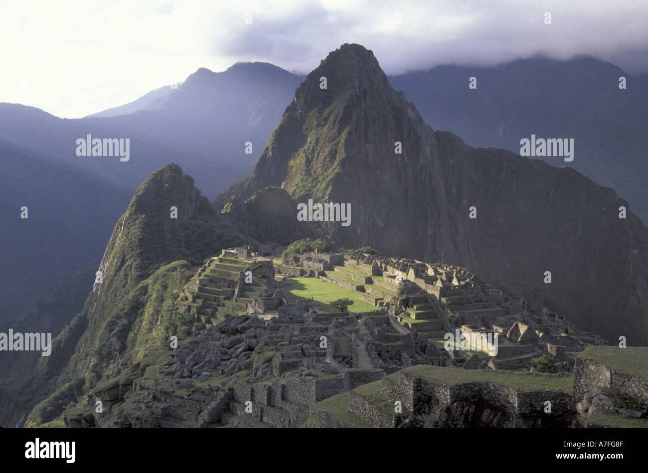 SA, Peru, Machu Picchu Ruins with ray of sunshine Stock Photo - Alamy