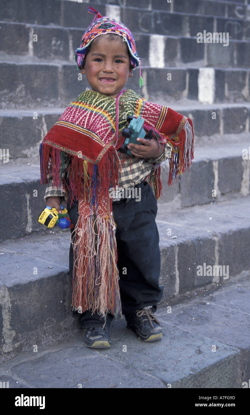SA, Peru, Cusco, Peruvian boy on steps, Plaza de Armas (MR Stock Photo ...
