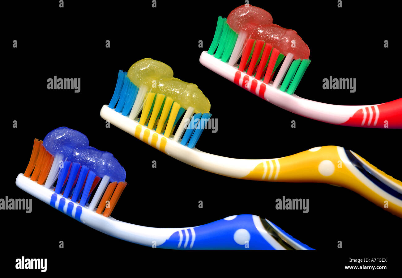 Three colourful toothbrushes Stock Photo - Alamy
