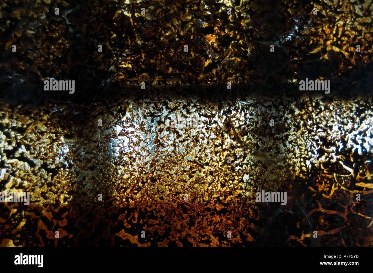 Glass window with amber pattern Stock Photo - Alamy
