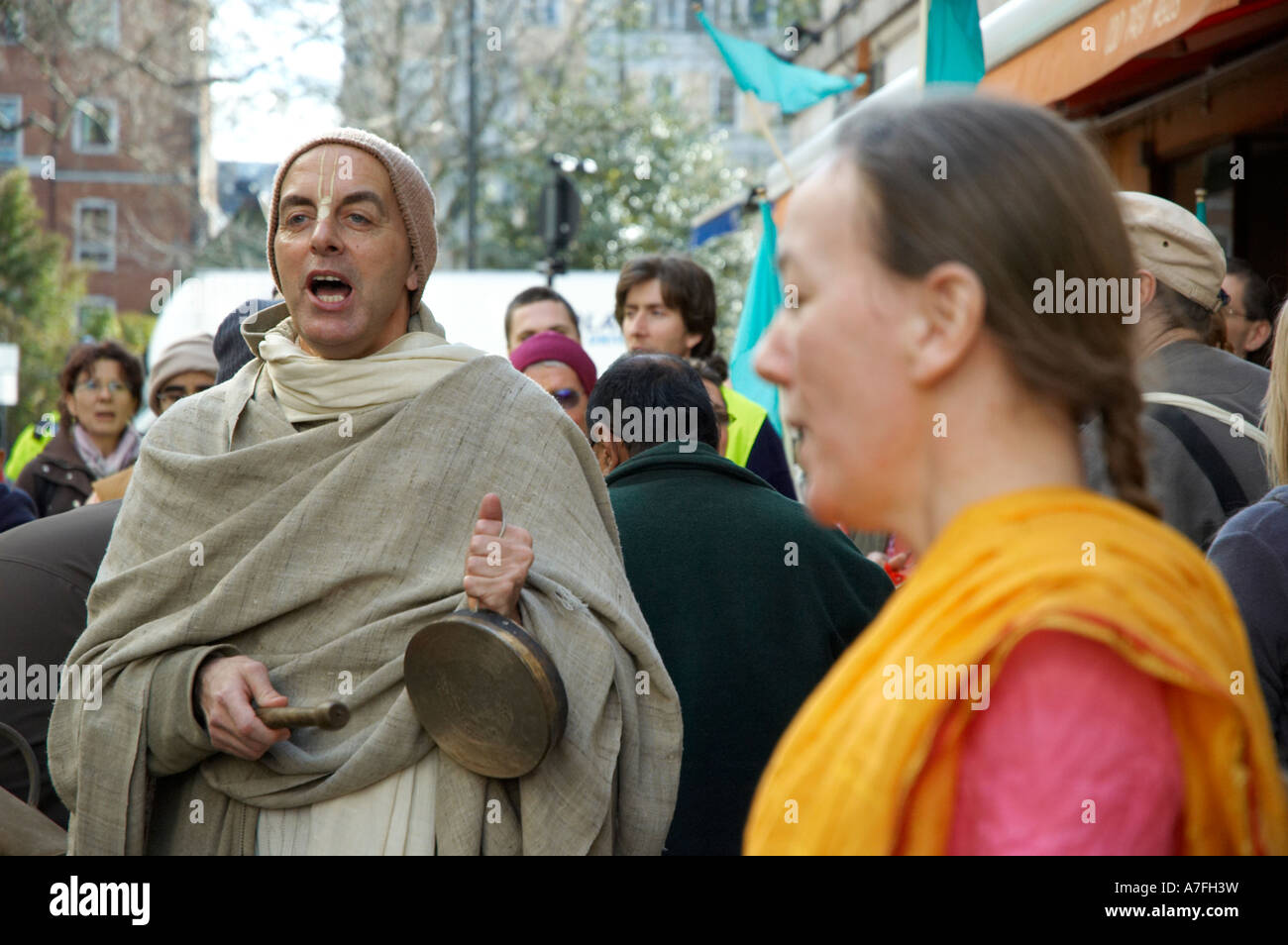 A Hare Krishna chants at the beginning of a Hare Krishna Parade from ...