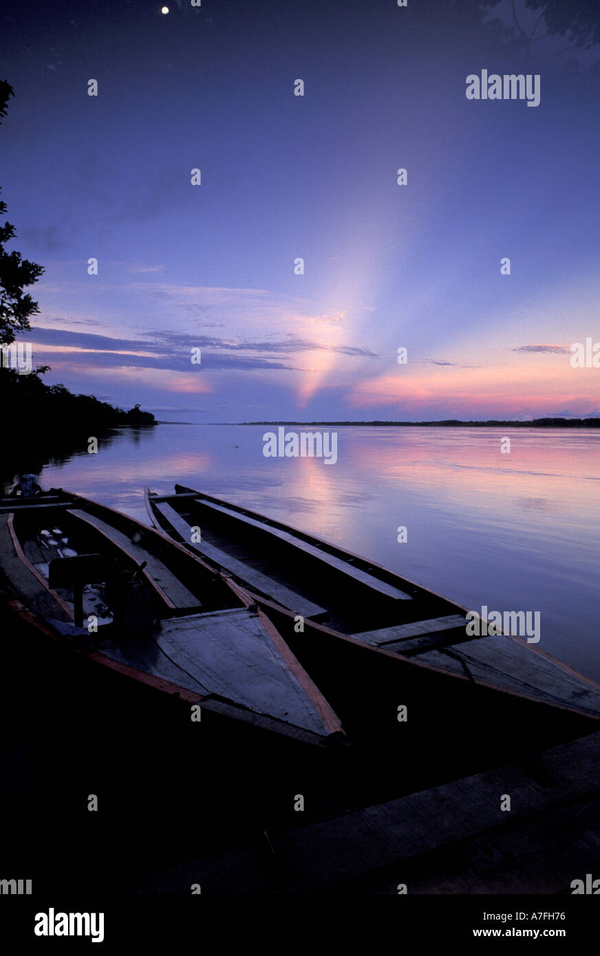SA, Peru, Sunset over the Amazon River and the Peruvian rainforest ...