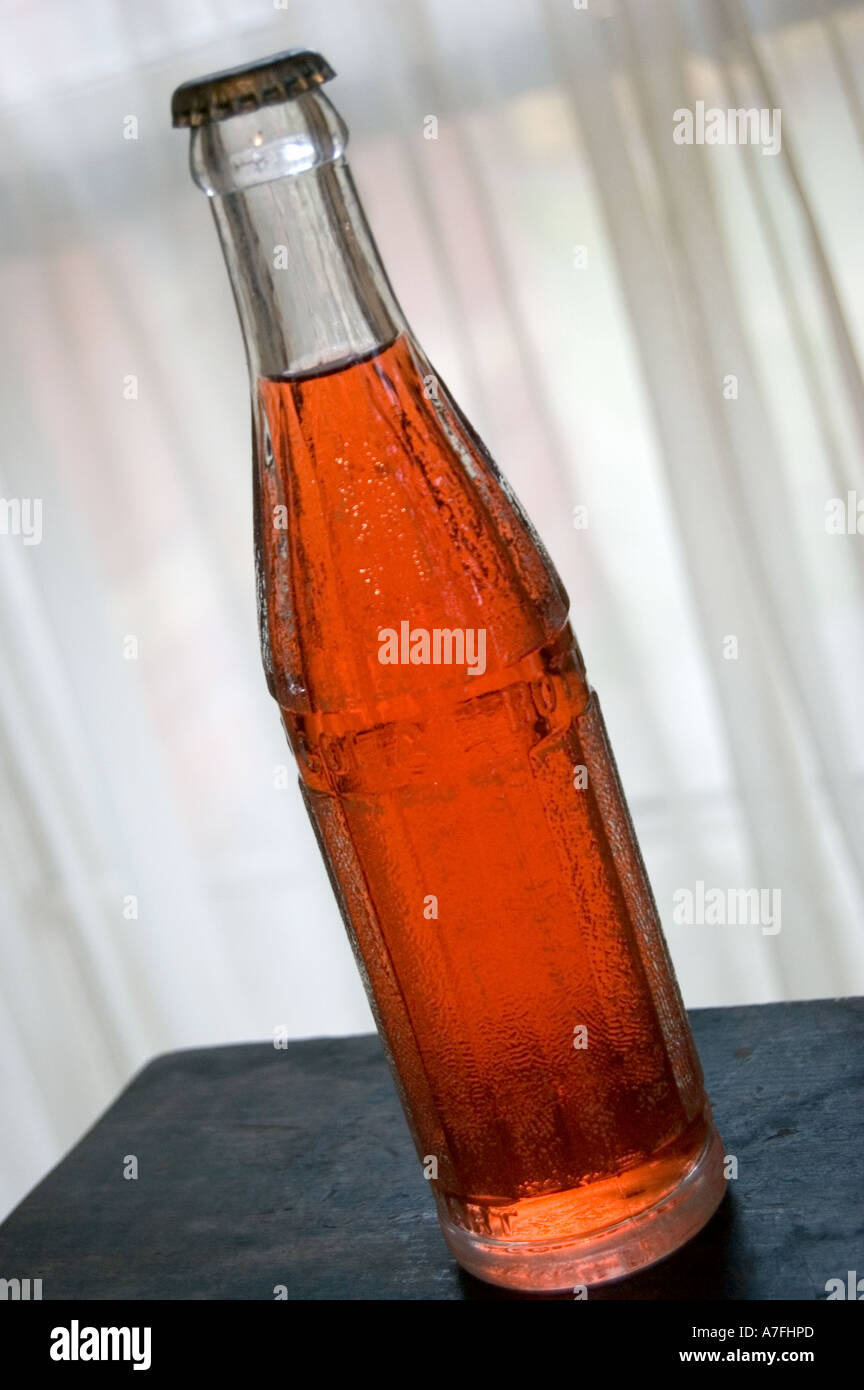 Red beverage in glass bottle Stock Photo - Alamy